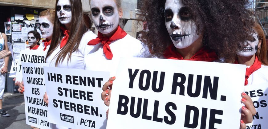 In Pictures: Years of Protesting Against the Running of the Bulls - PETA UK